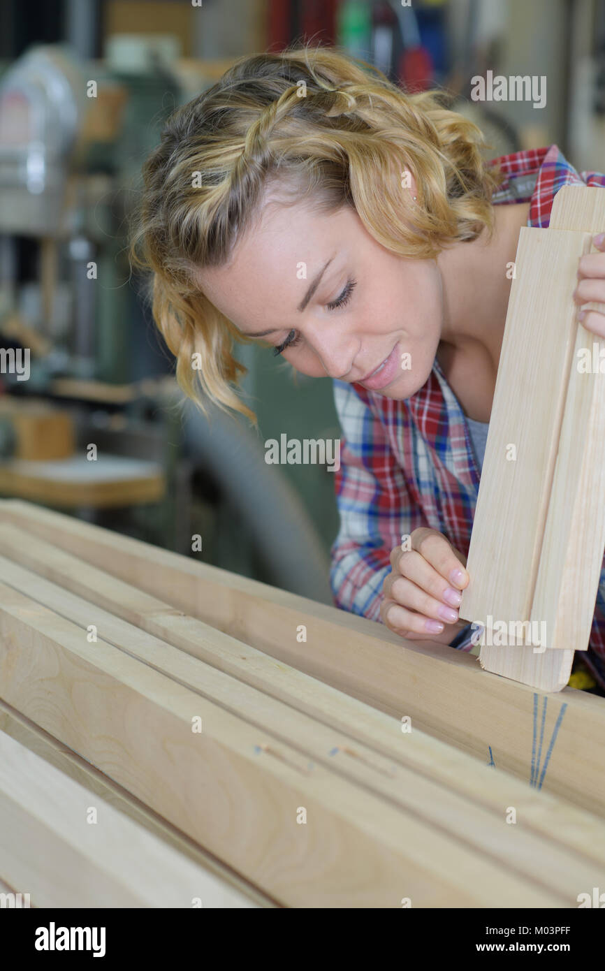 female carpenter using plane in woodworking woodshop Stock Photo - Alamy