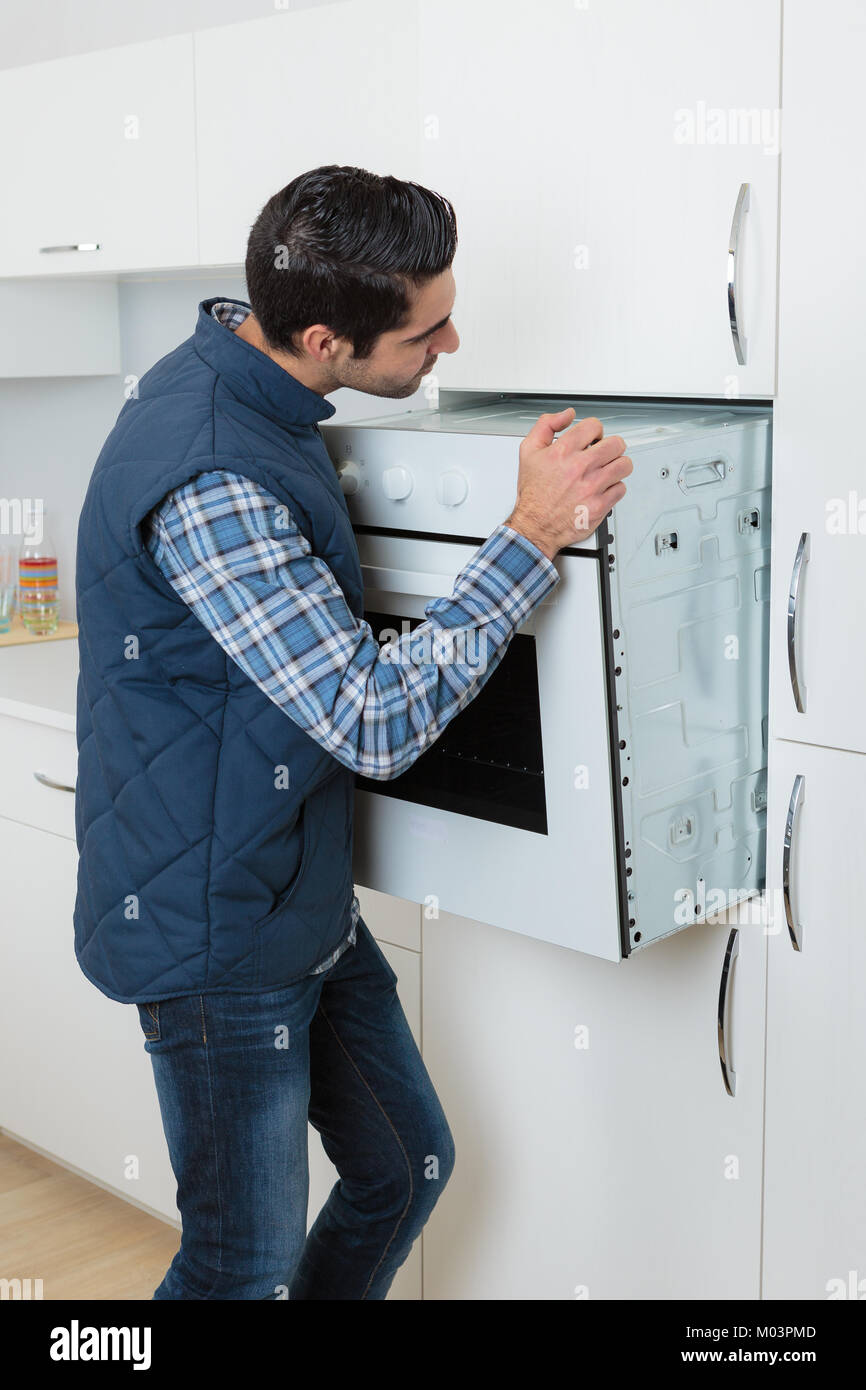 fitting an oven Stock Photo - Alamy