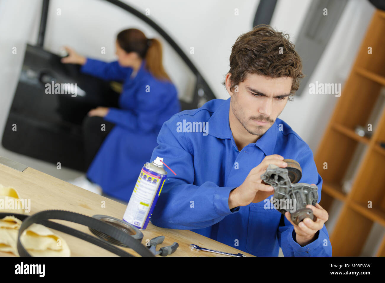 student with auto part studying automotive trade Stock Photo - Alamy