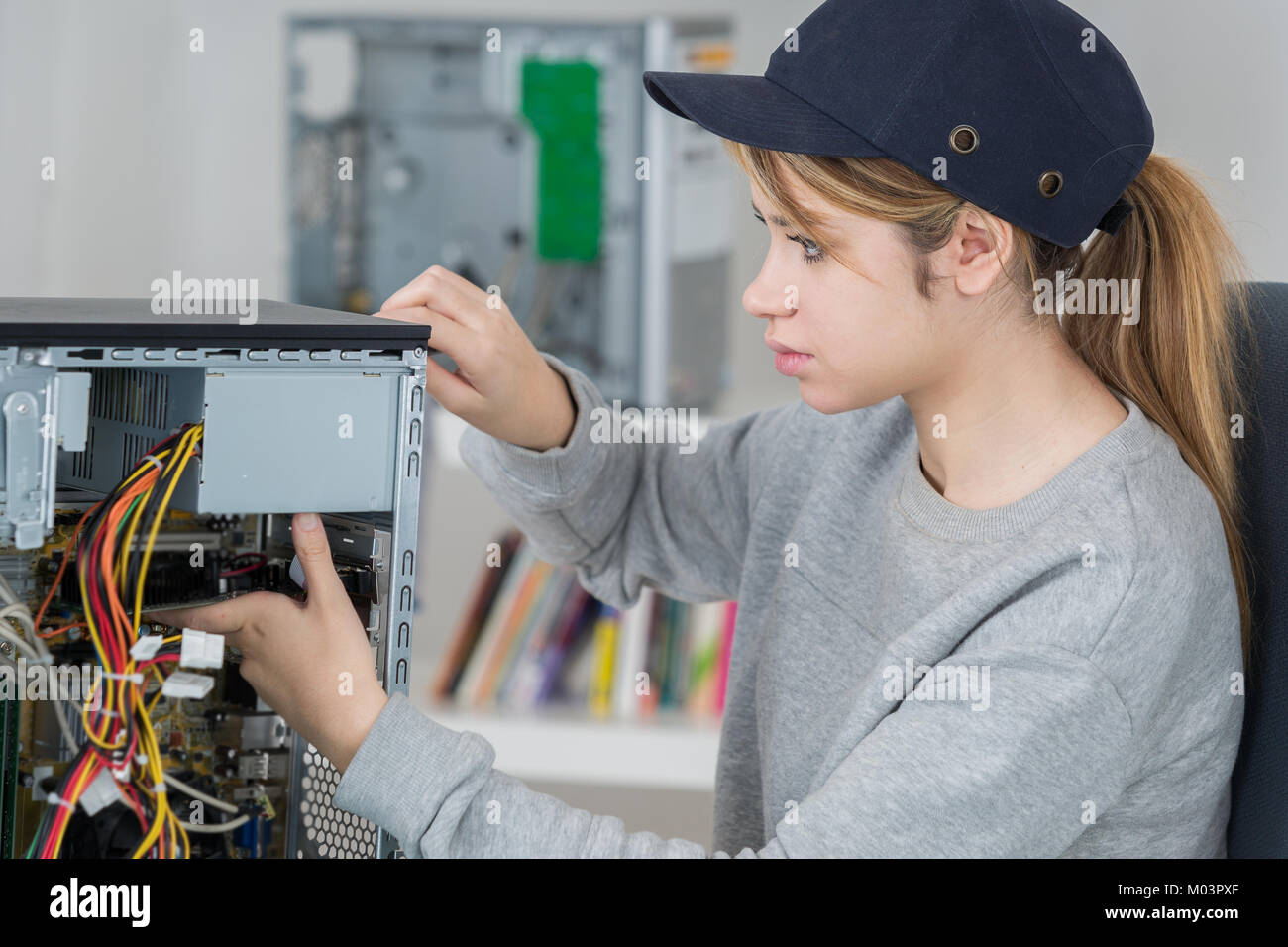 girl with a tester and a printed circuit board Stock Photo - Alamy