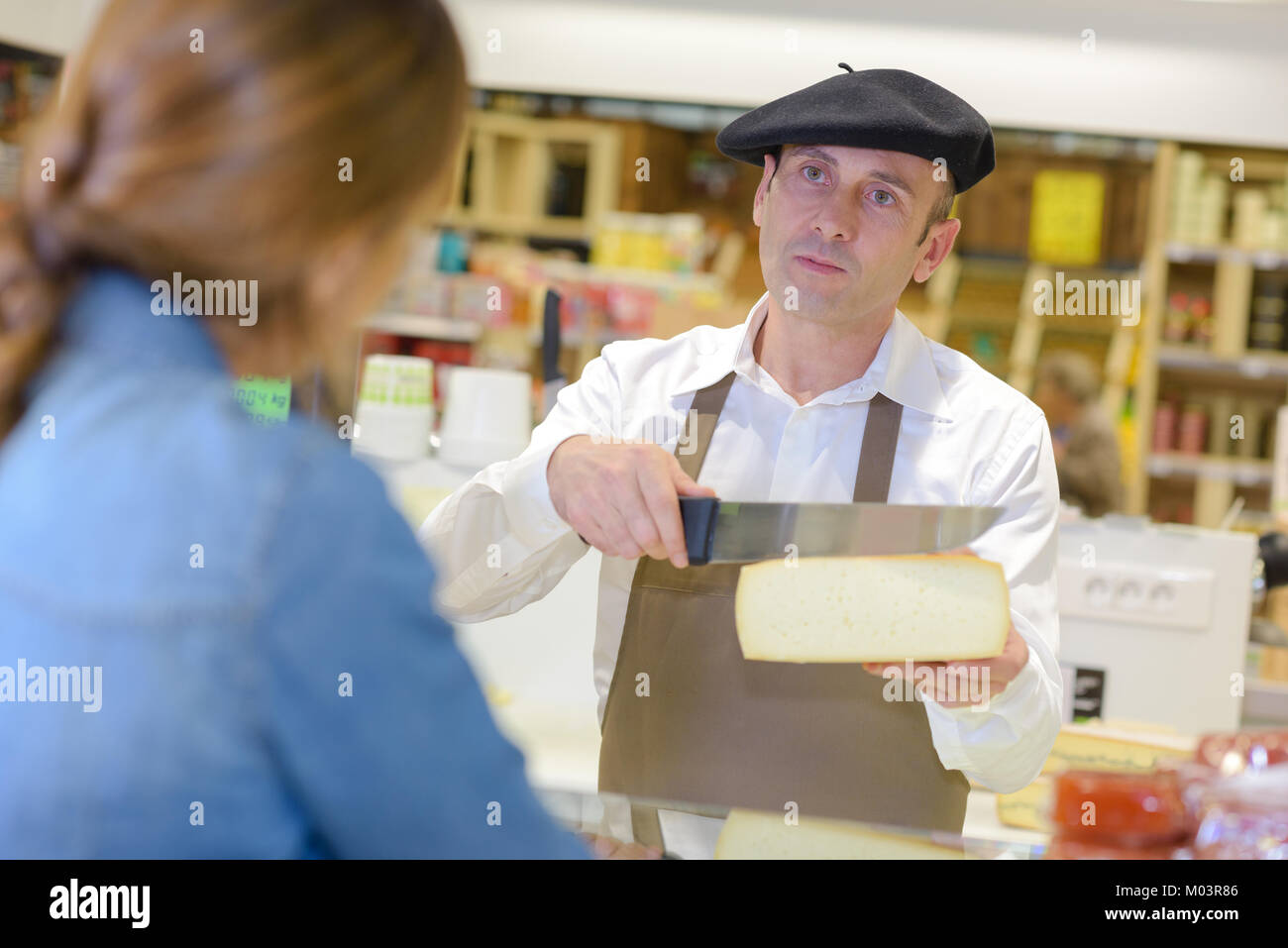 slicing a cheese Stock Photo - Alamy