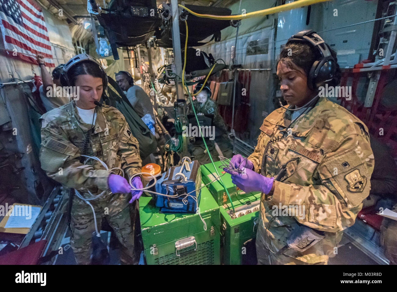U.S. Air Force Lt. Col. Deveril Wint (right), medical crew director ...