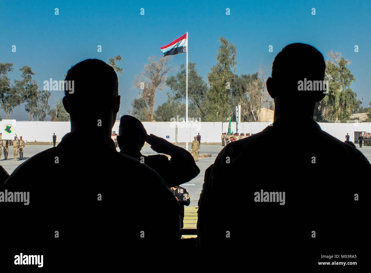 Two Counter Terrorism Service graduation ceremony guests stand as a ...