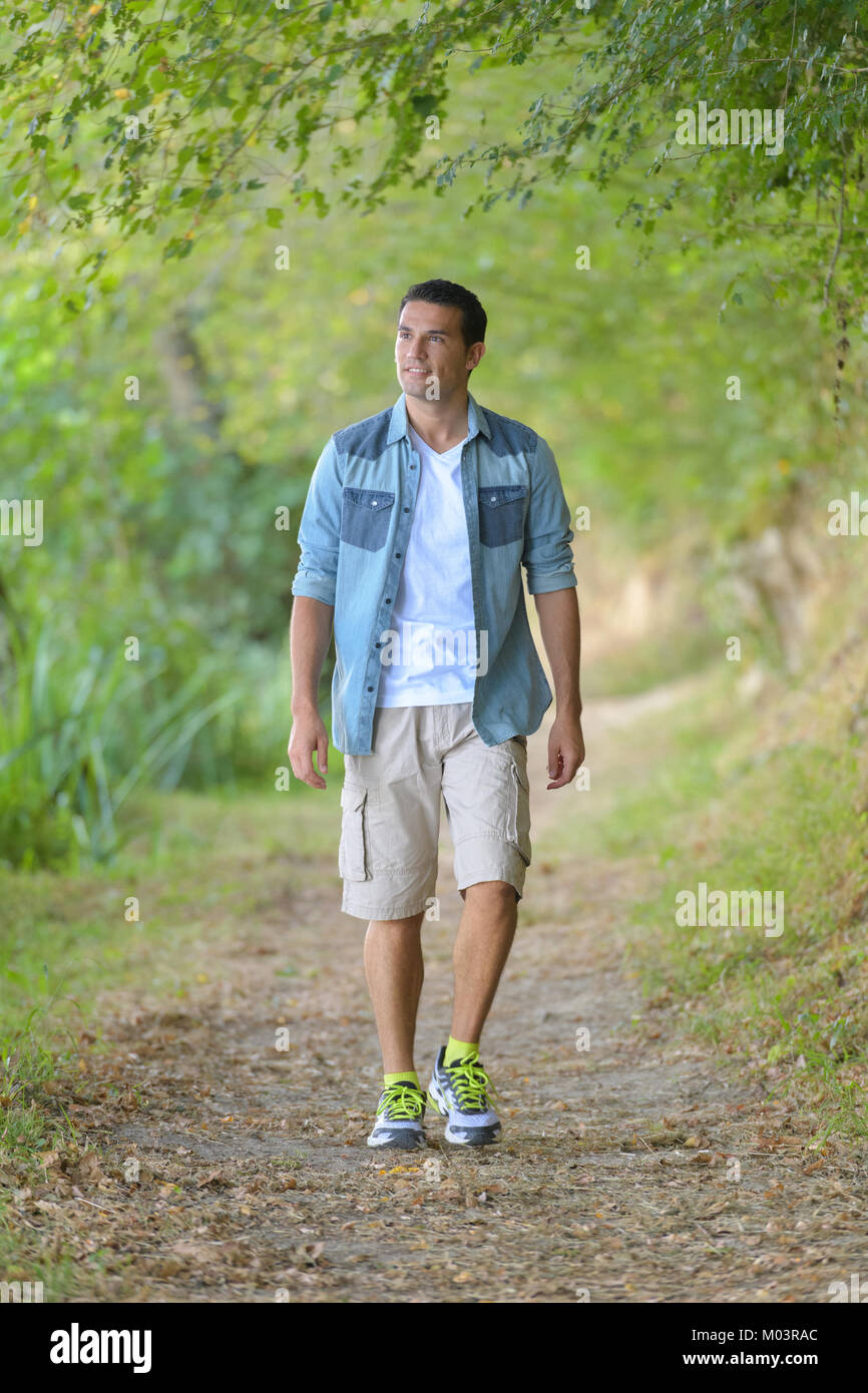 happy man walking and relaxing in park Stock Photo - Alamy