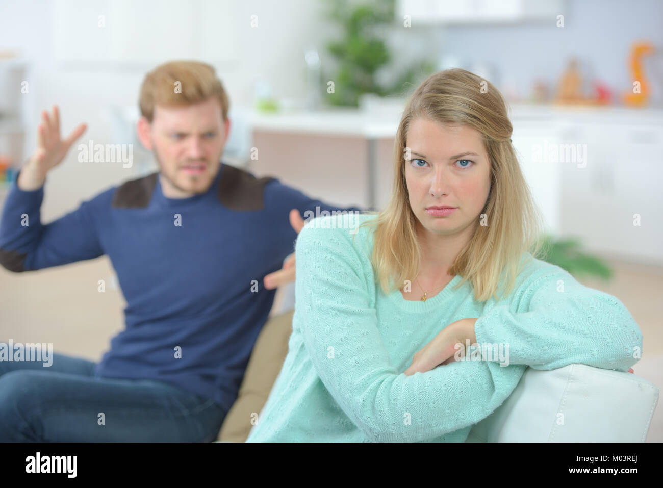 Couple arguing on the sofa Stock Photo - Alamy