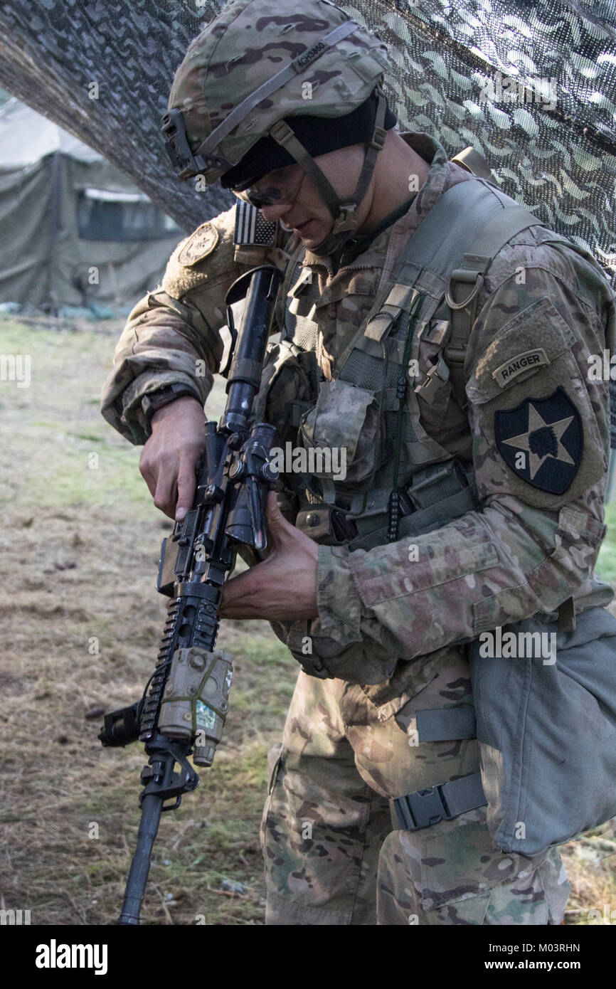 A Soldier with 1-2 Stryker Brigade Combat Team practices M4 Rifle ...