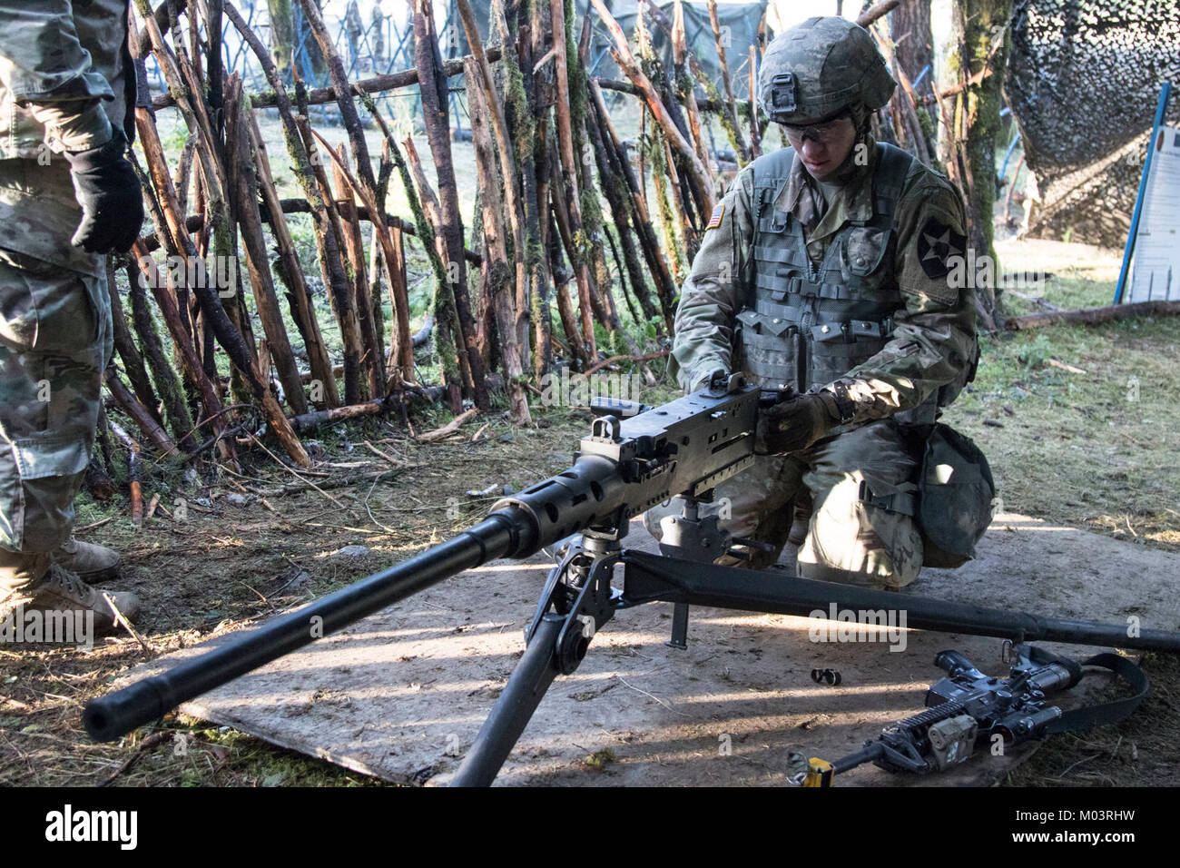A Soldier with 1-2 Stryker Brigade Combat Team practices correcting a ...
