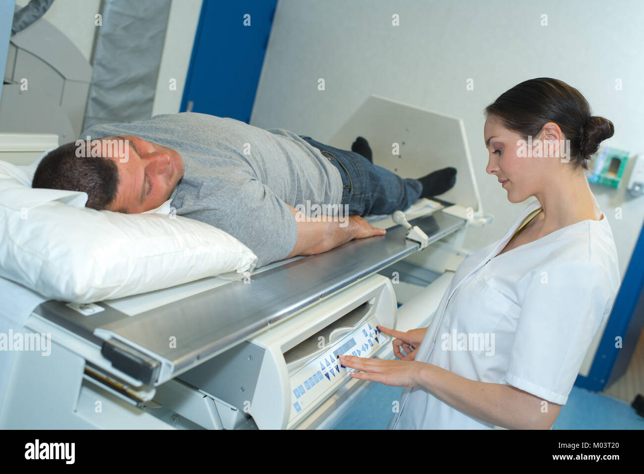 male patient lying down for an examination Stock Photo - Alamy