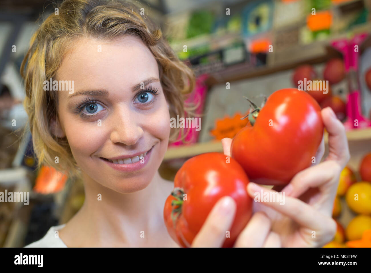 woman holding tomatoes Stock Photo - Alamy
