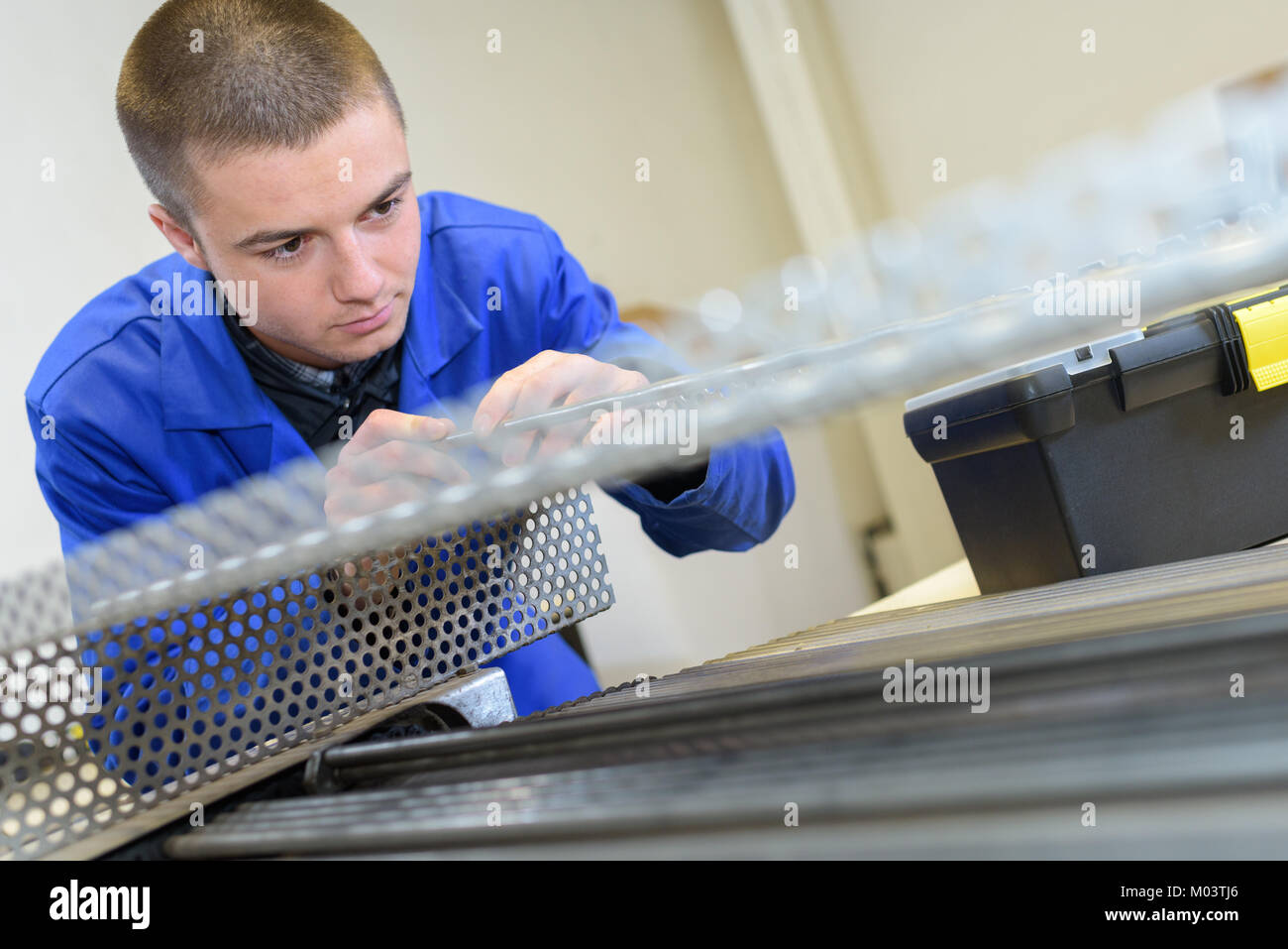 young man metallurgist at work Stock Photo - Alamy