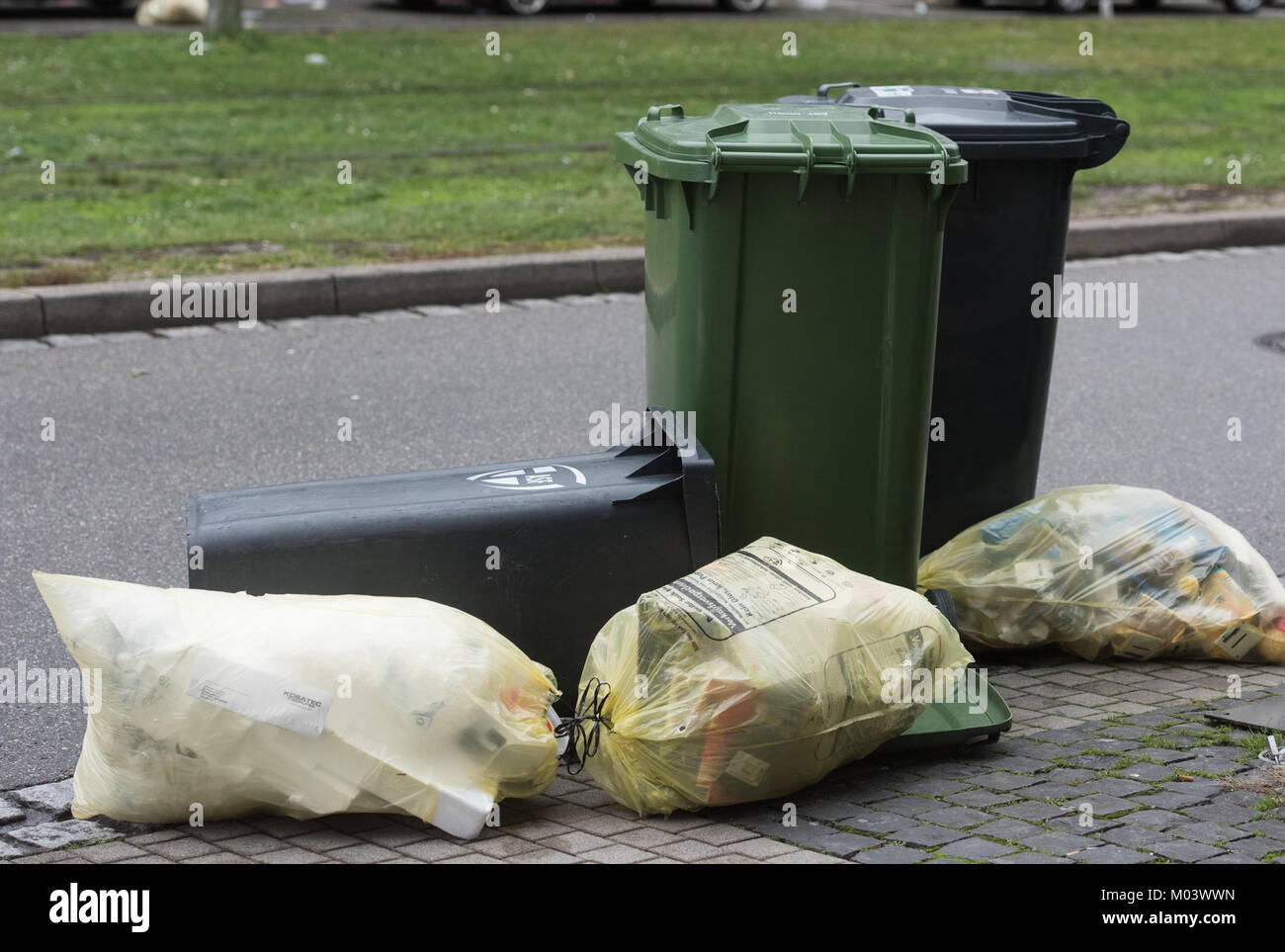 Freiburg, Germany. 18th Jan, 2018. A trash can is blown over by heavy ...