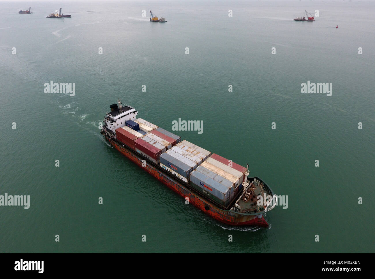 Nanning. 10th Jan, 2018. A cargo ship sails in Qinzhou port of south ...