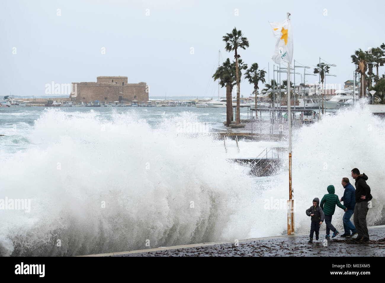 Paphos, Cyprus. 18th Jan, 2018. A group of people watch as large waves ...