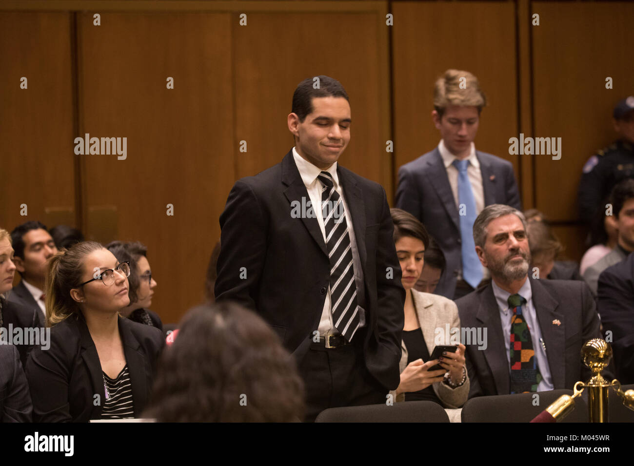 John Magdaleno stands after being introduced by Sen. Dick Durbin (D-Ill ...
