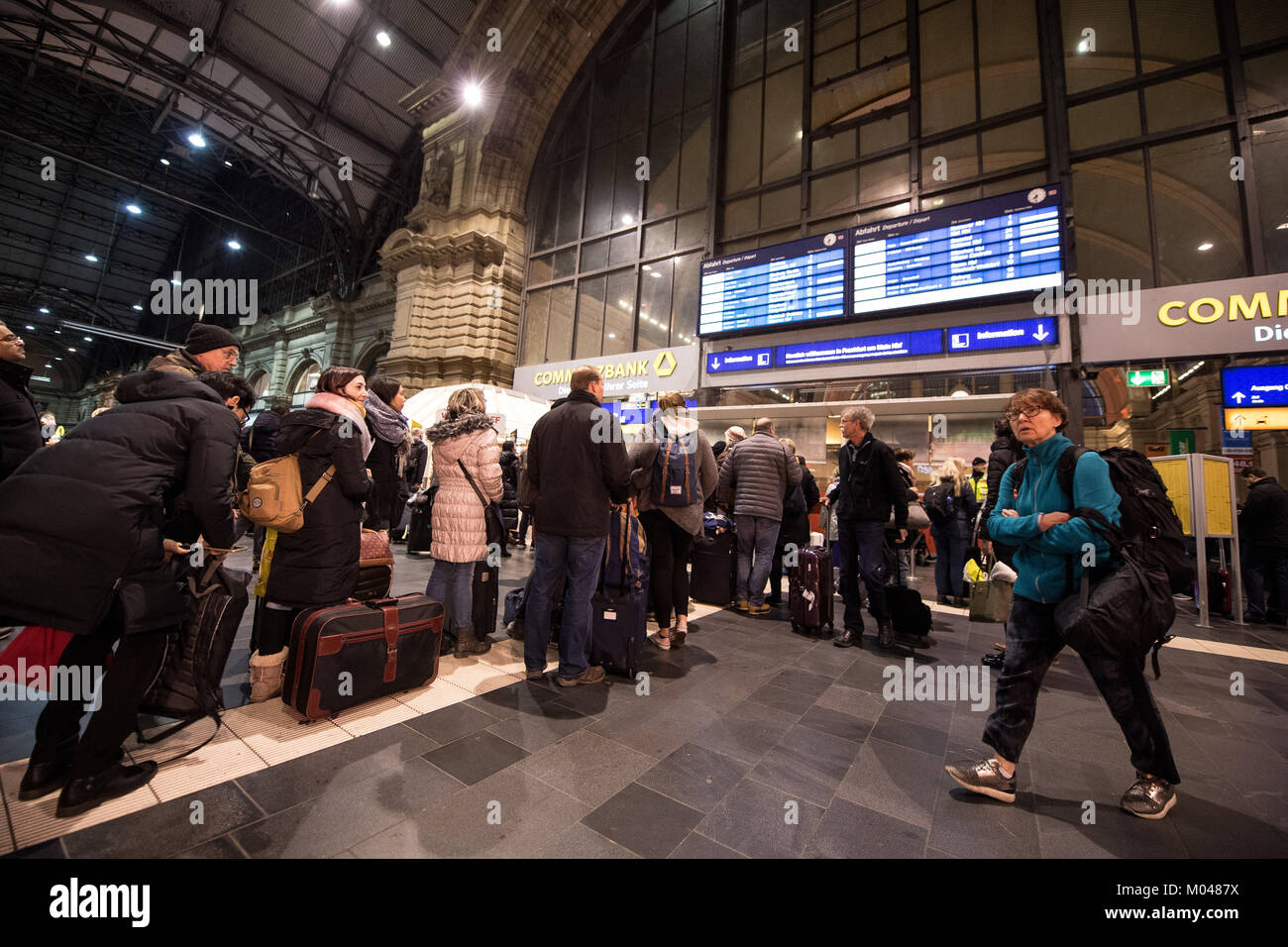 Passengers wait in a long queue at the service-point of the German ...