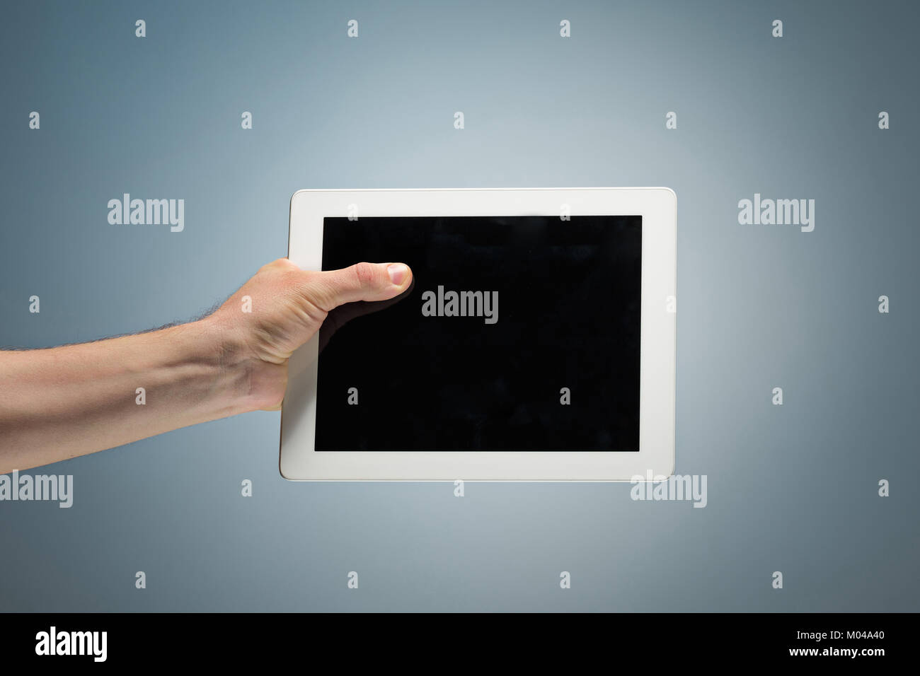 male hand holding a laptop Stock Photo - Alamy