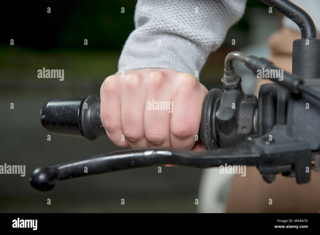 a close up of hand on handlebar Stock Photo - Alamy
