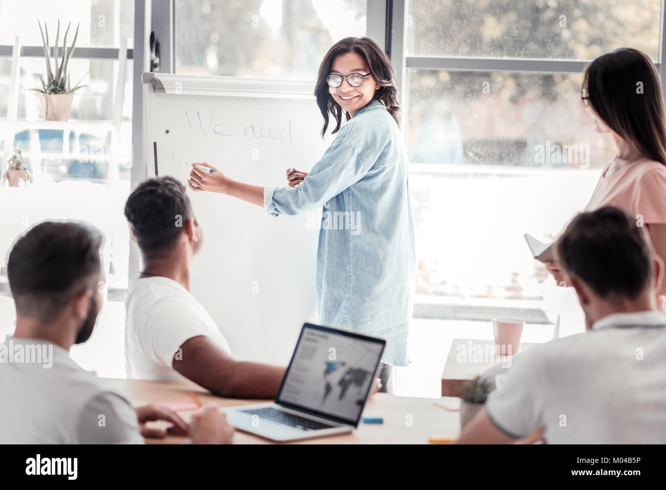 Young lady presenting her business ideas during presentation Stock ...