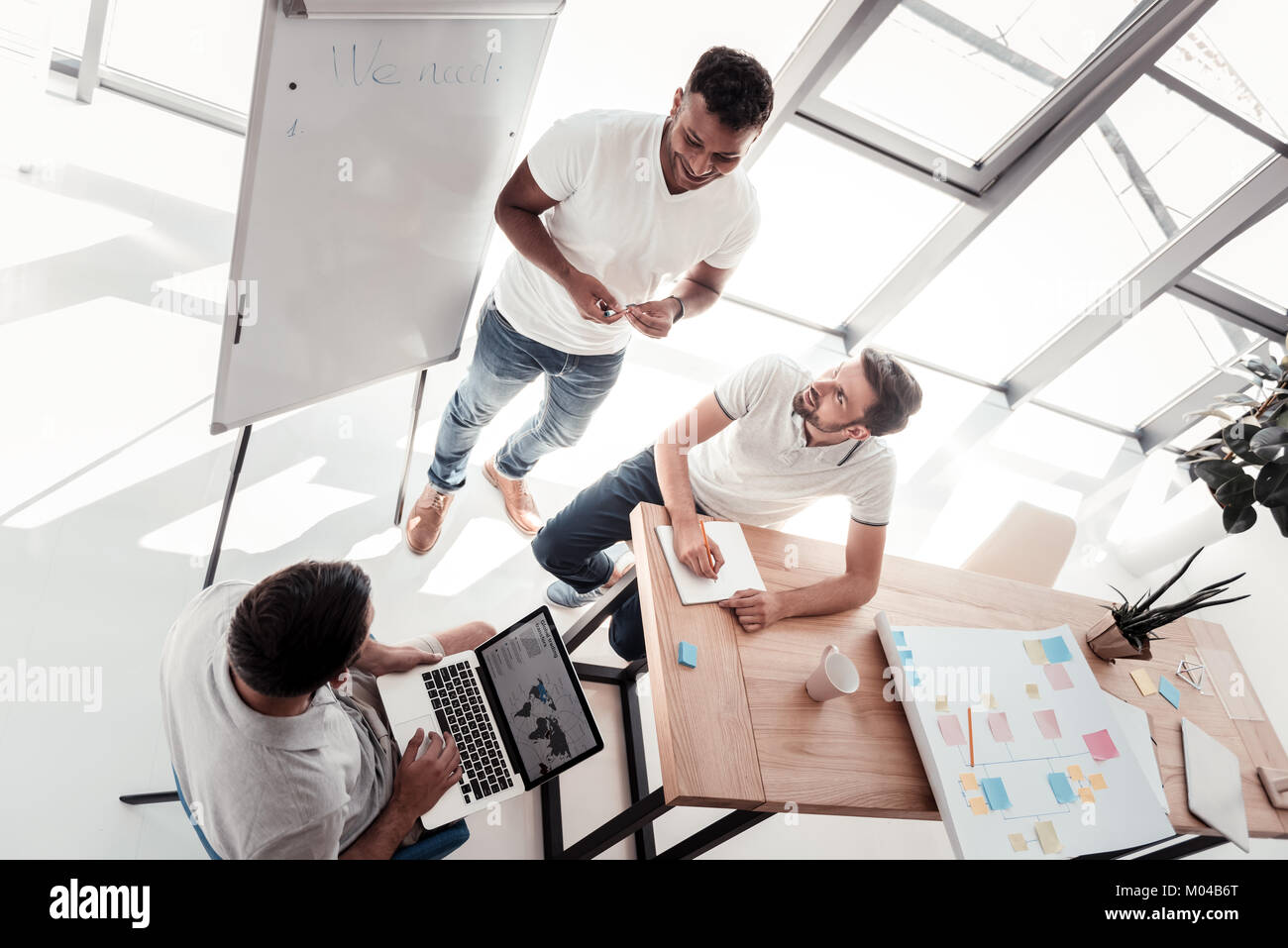 College friends discussing home project together Stock Photo - Alamy