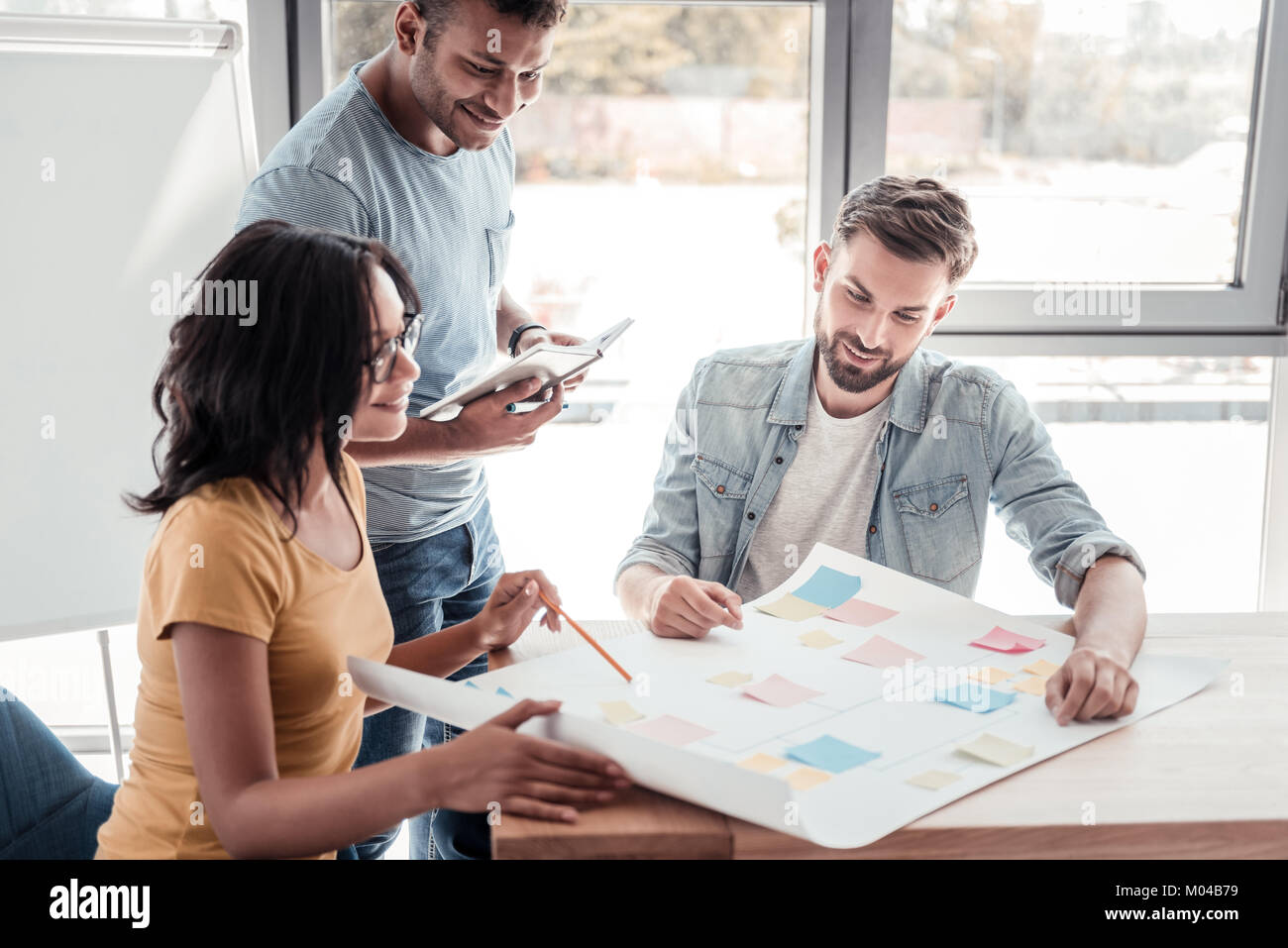 Creative college people working on project together Stock Photo - Alamy