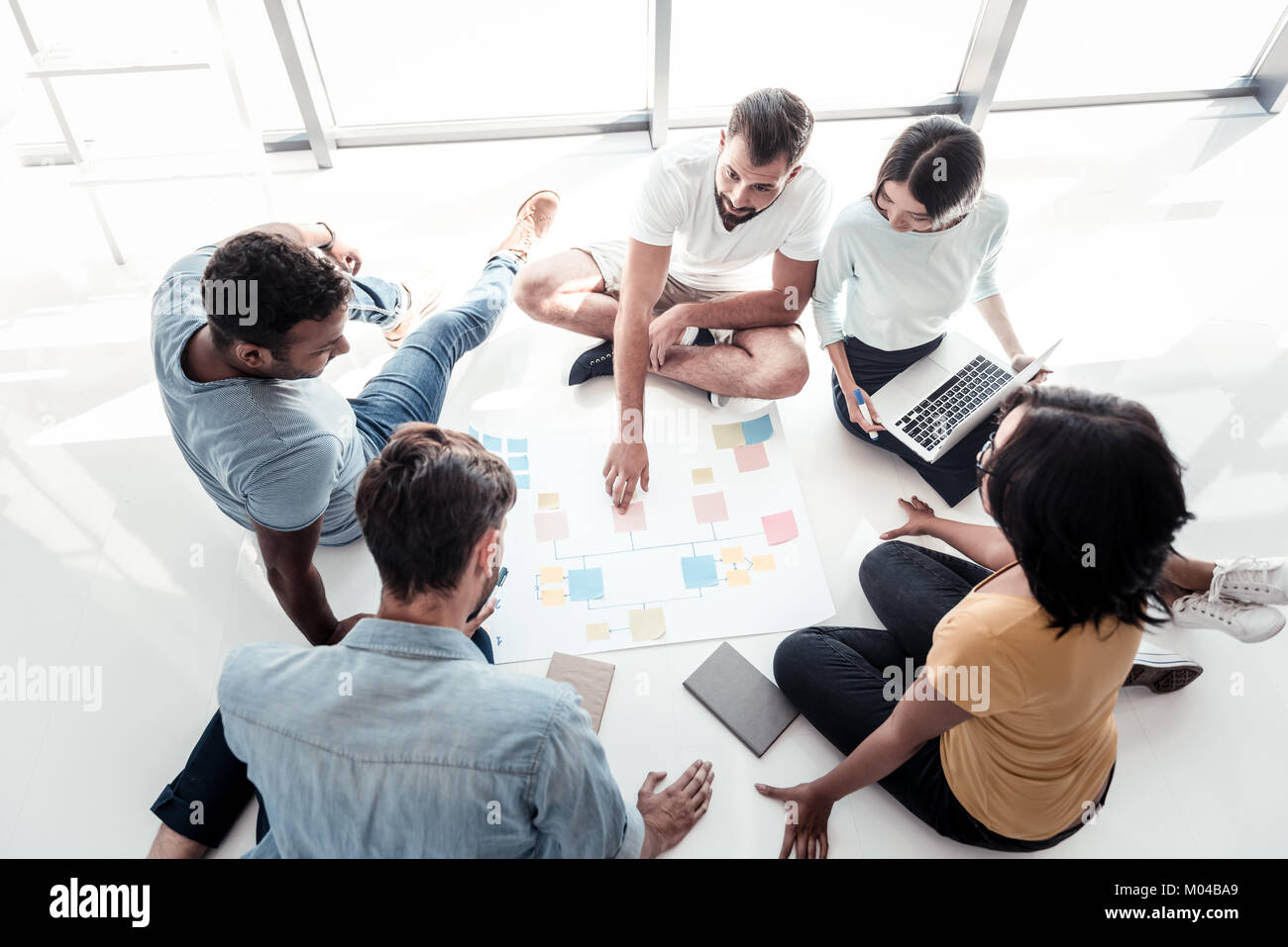 Supportive college people collaborating on project Stock Photo - Alamy