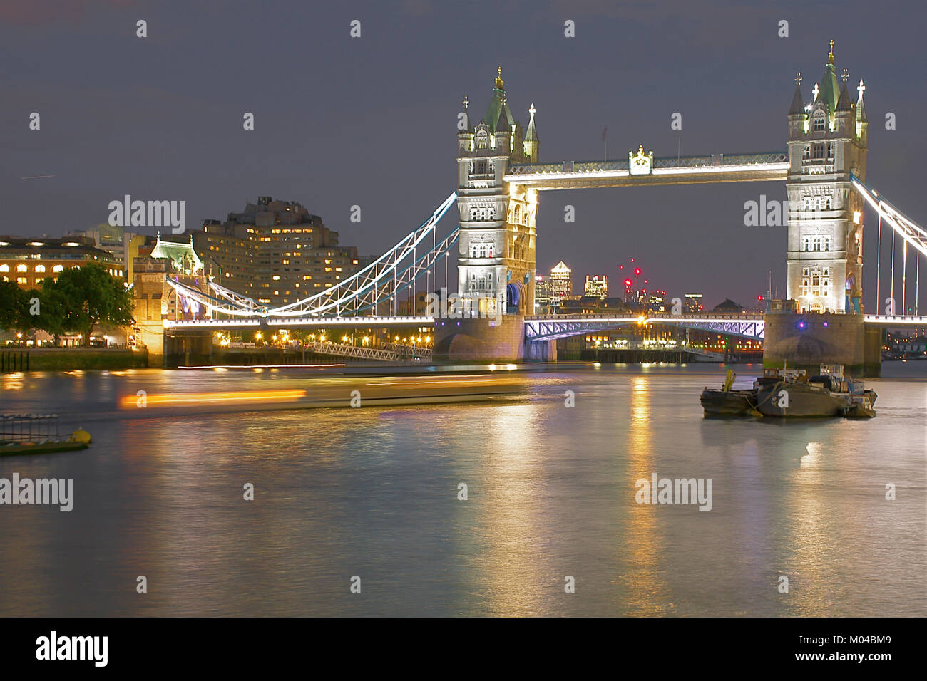Famous Tower Bridge over Thames with beautiful lights reflections in ...