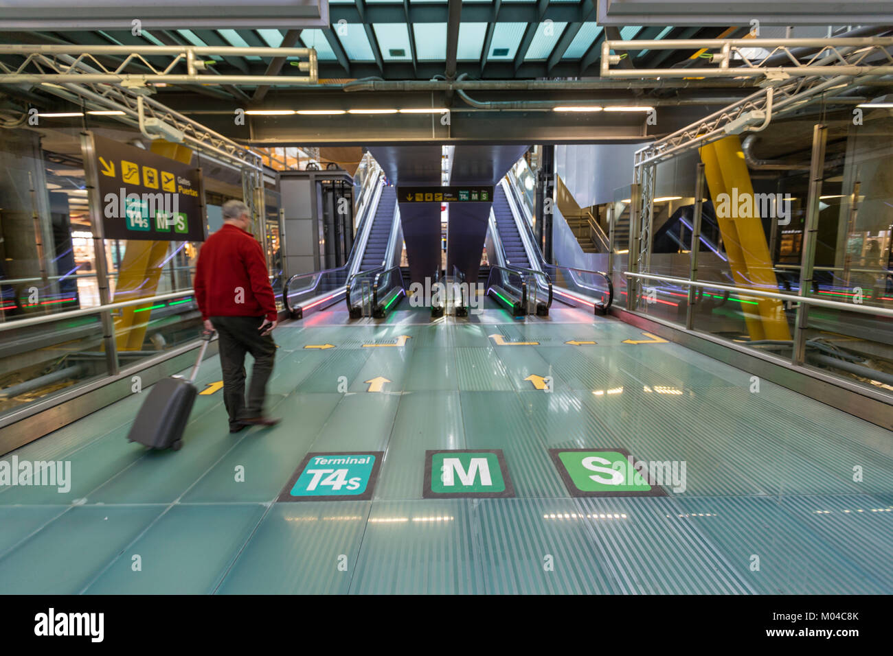 Passengers towards the mechanic stairs in Adolfo Suárez Madrid–Barajas ...