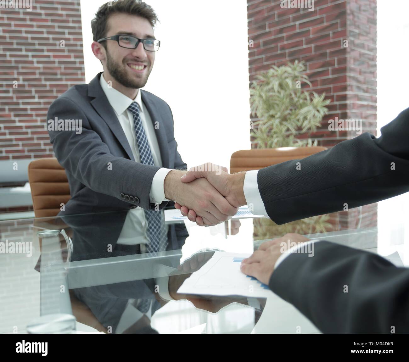 closeup. handshake between the financial Manager and the client Stock ...