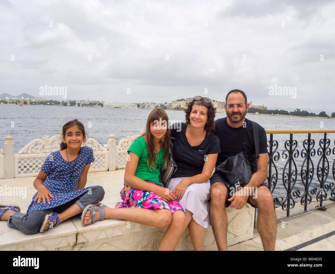 A photograph of a family of tourists enjoying a visit to the royal lake ...