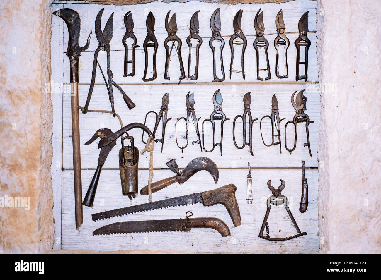 Old tools collection on wooden wall. Abstract photo Stock Photo - Alamy