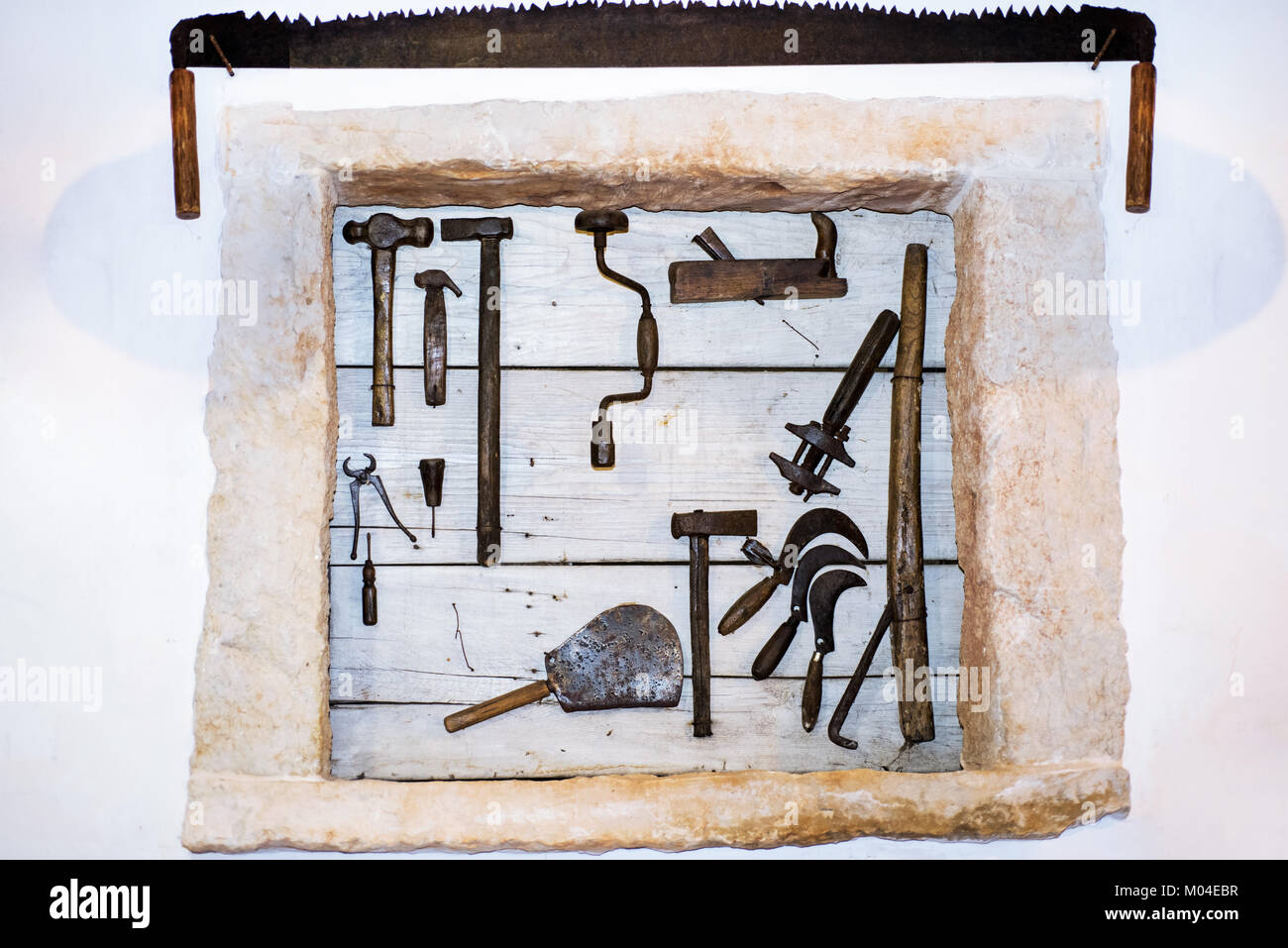 Old tools collection on wooden wall. Abstract photo Stock Photo - Alamy