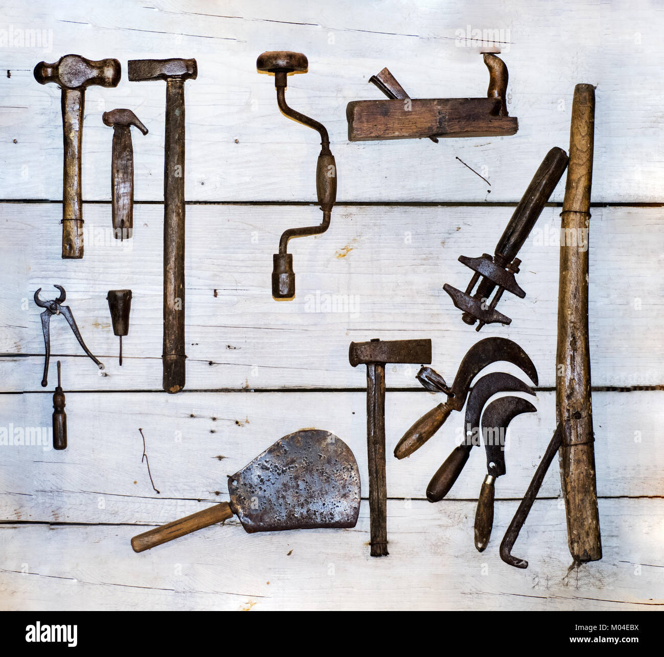 Old tools collection on wooden wall. Abstract photo Stock Photo - Alamy