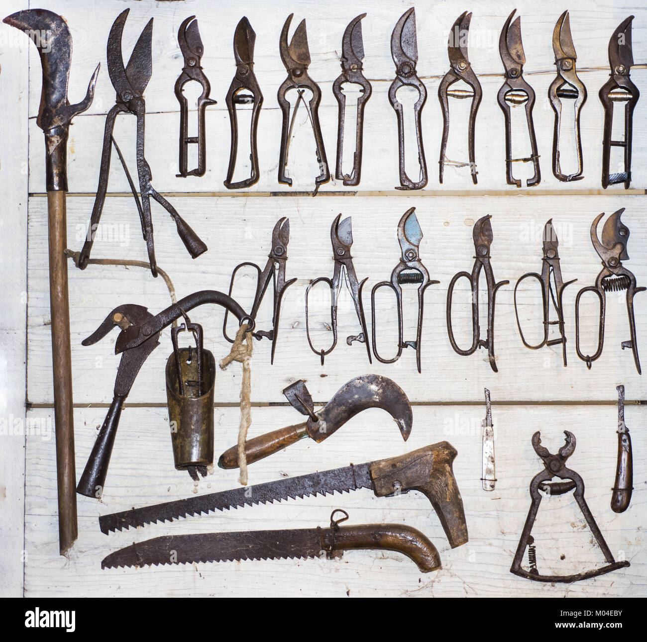 Old tools collection on wooden wall. Abstract photo Stock Photo - Alamy