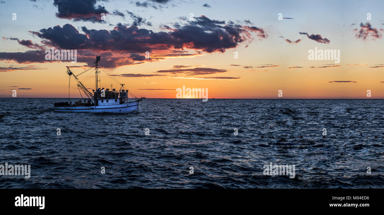Small ship in sea. Summer day sunset. Panoramic view Stock Photo - Alamy