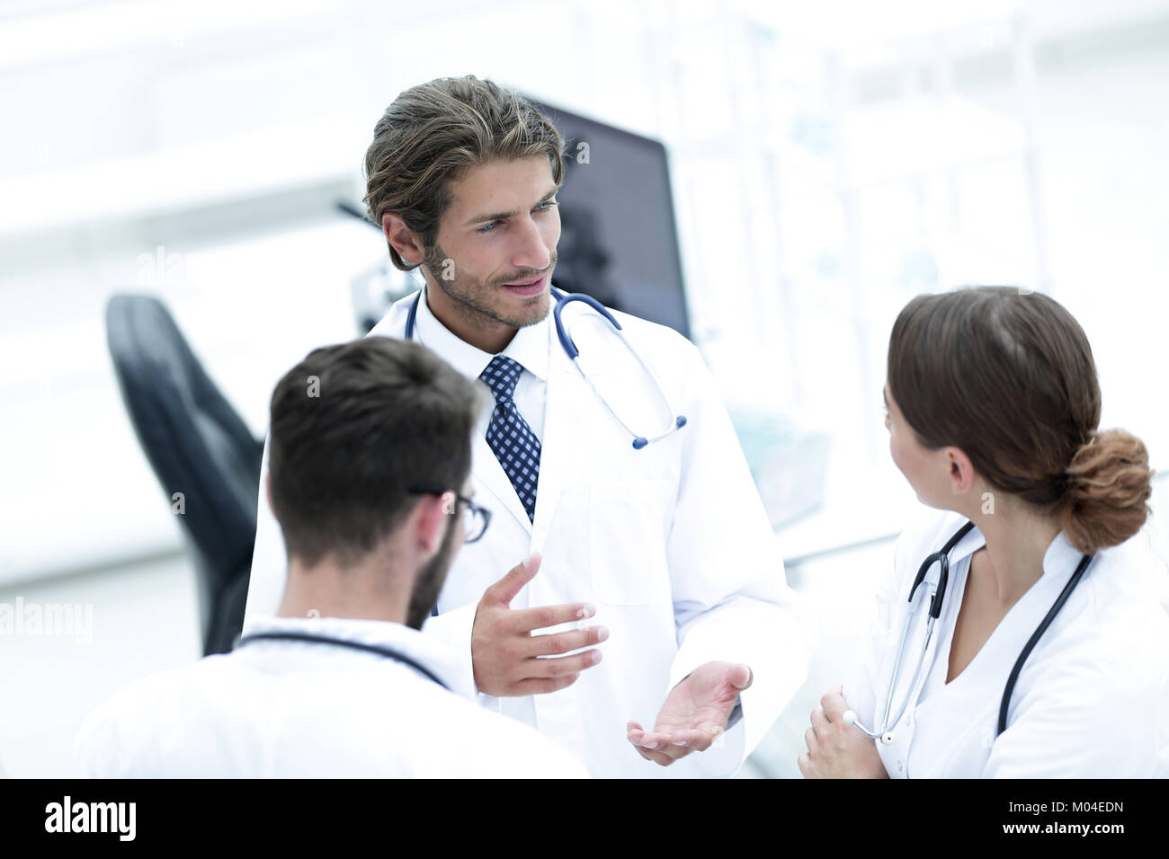 Group of doctors talking Stock Photo - Alamy