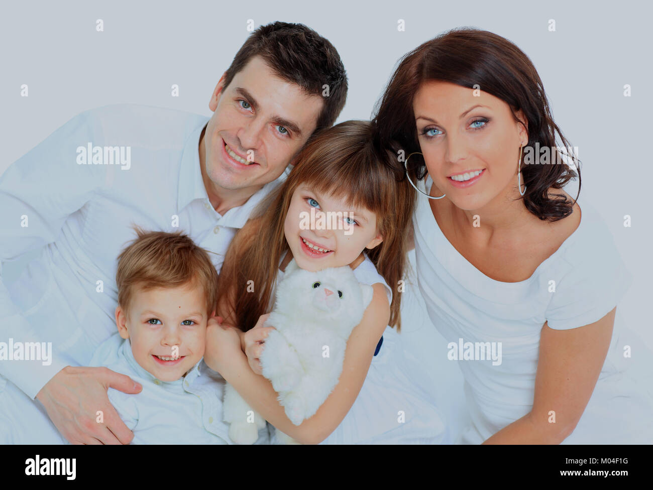 Beautiful happy family - isolated over a white background Stock Photo ...