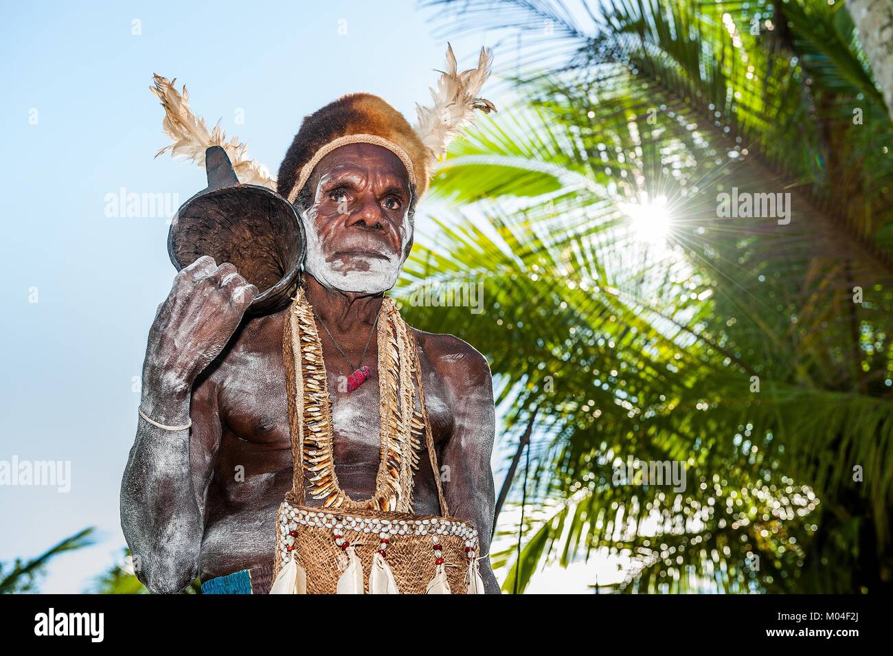 Leader of Asmat tribe with drum (em). The In the village of Asmates ...