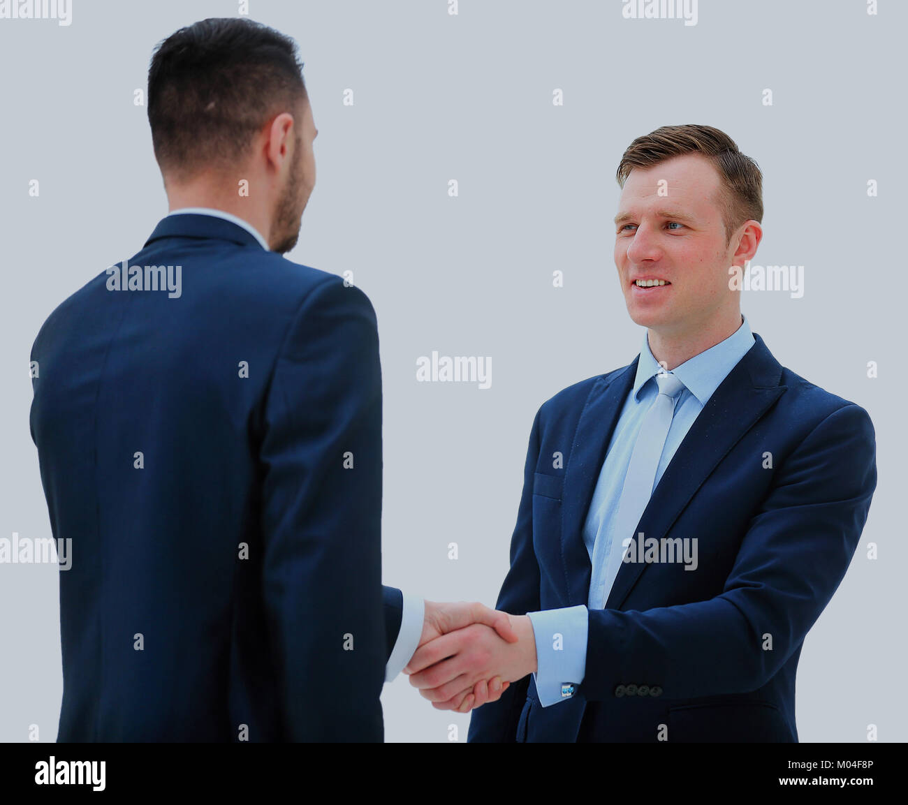 Business colleagues sitting at a table during a meeting with two male ...