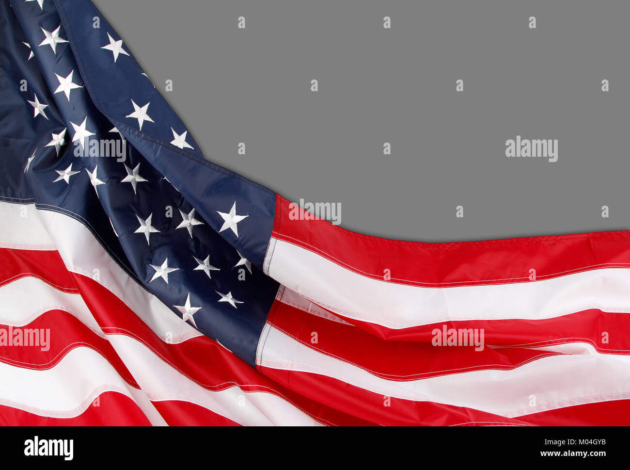 Closeup of American flag on grey background Stock Photo - Alamy