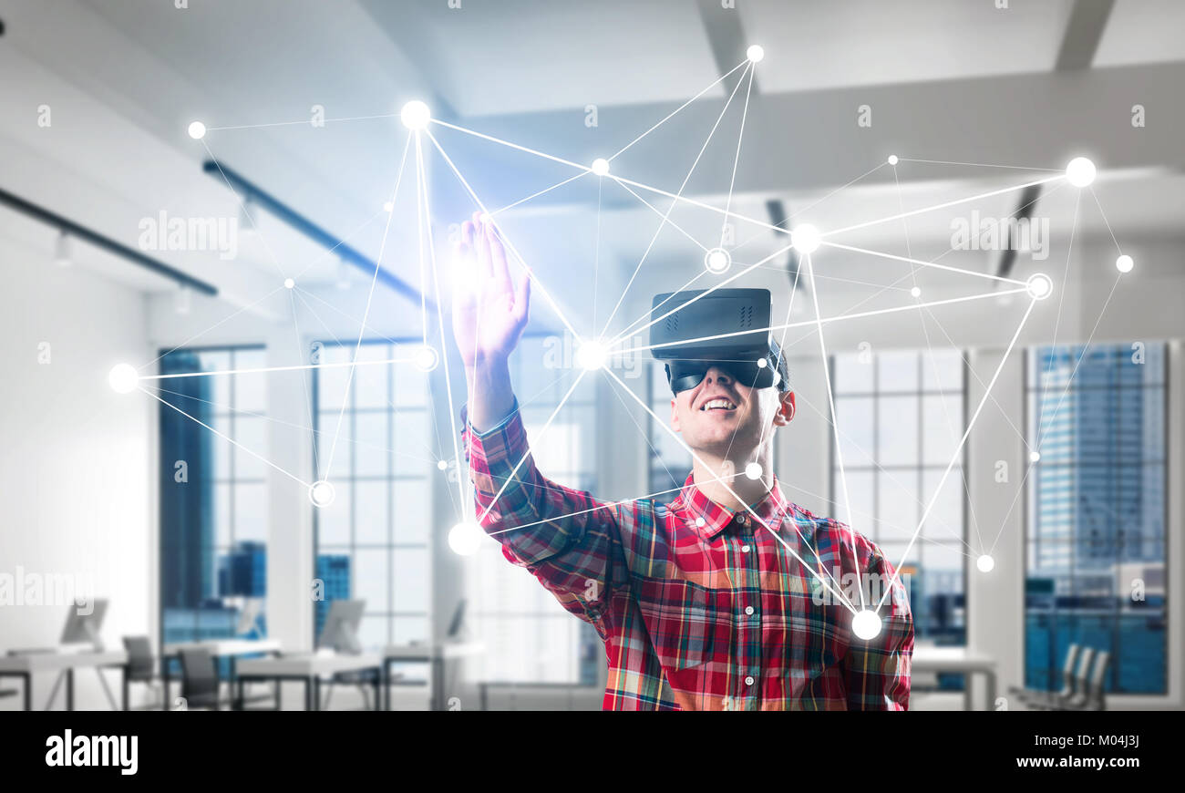 Guy wearing checked shirt and virtual mask reaching hand to touch ...