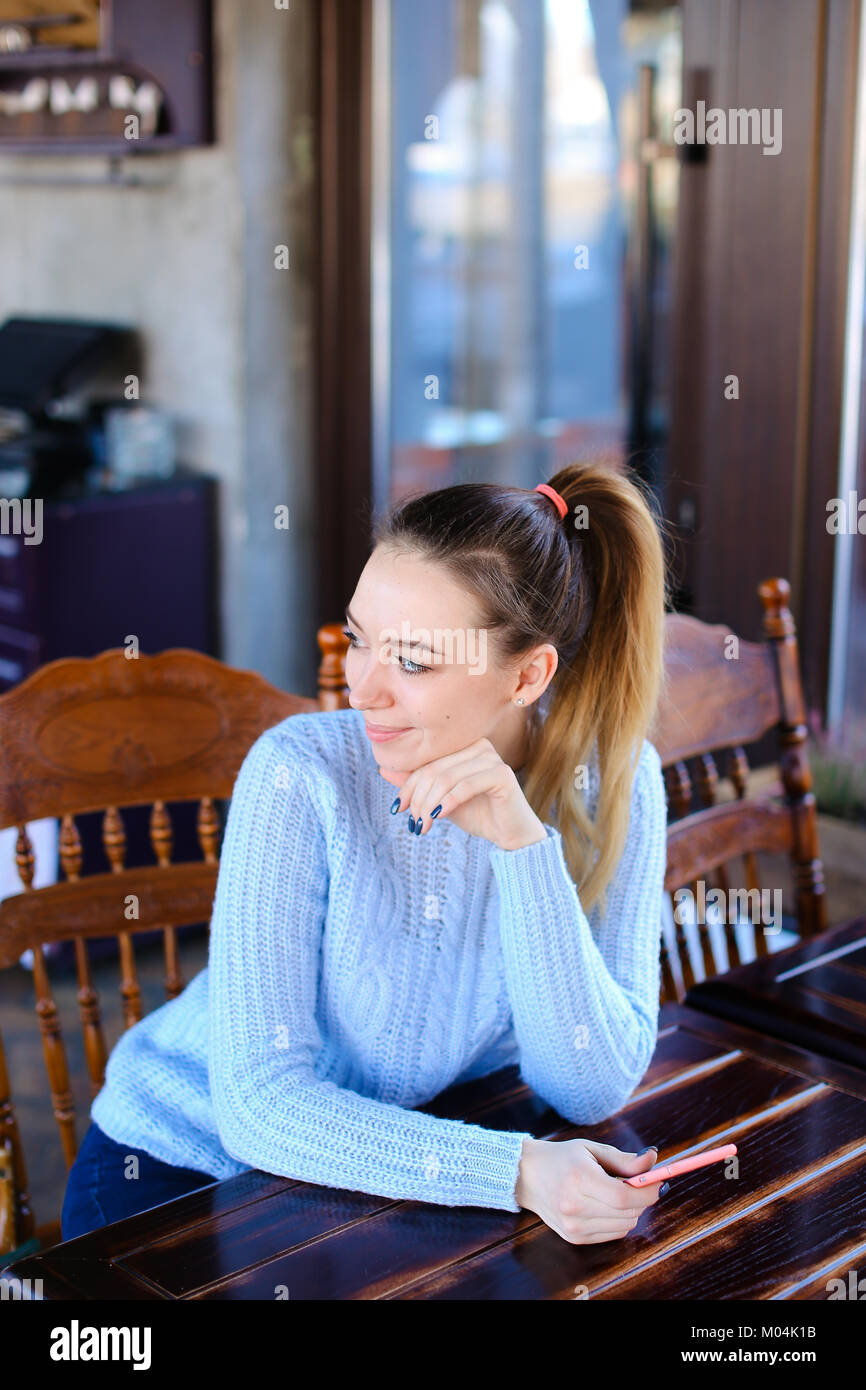 Model waiting photographer for photoshoot in cafe Stock Photo - Alamy