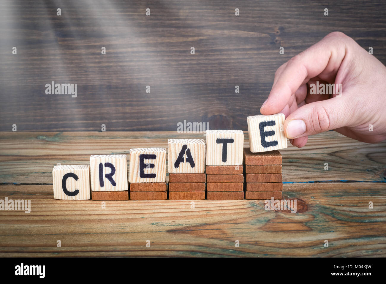 create. Wooden letters on the office desk, informative and ...