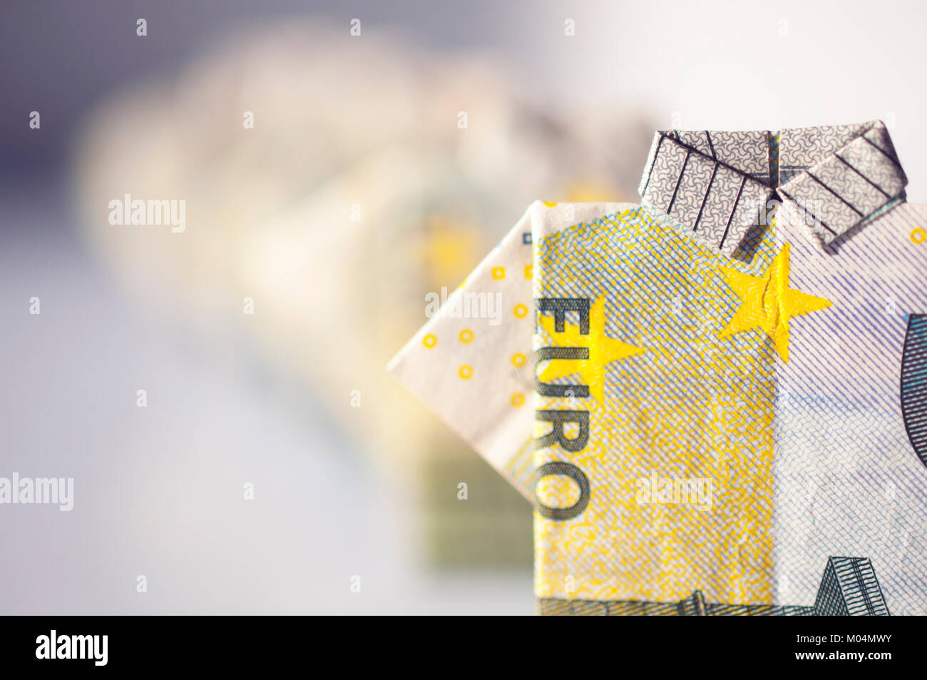 A row of men made with 5 euro bills folded like a t-shirt with copy ...