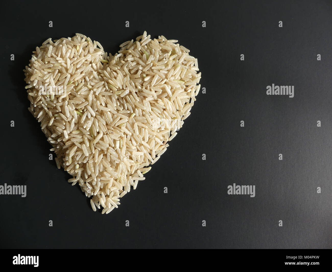 Black background white heart rice japanese kitchen Stock Photo - Alamy