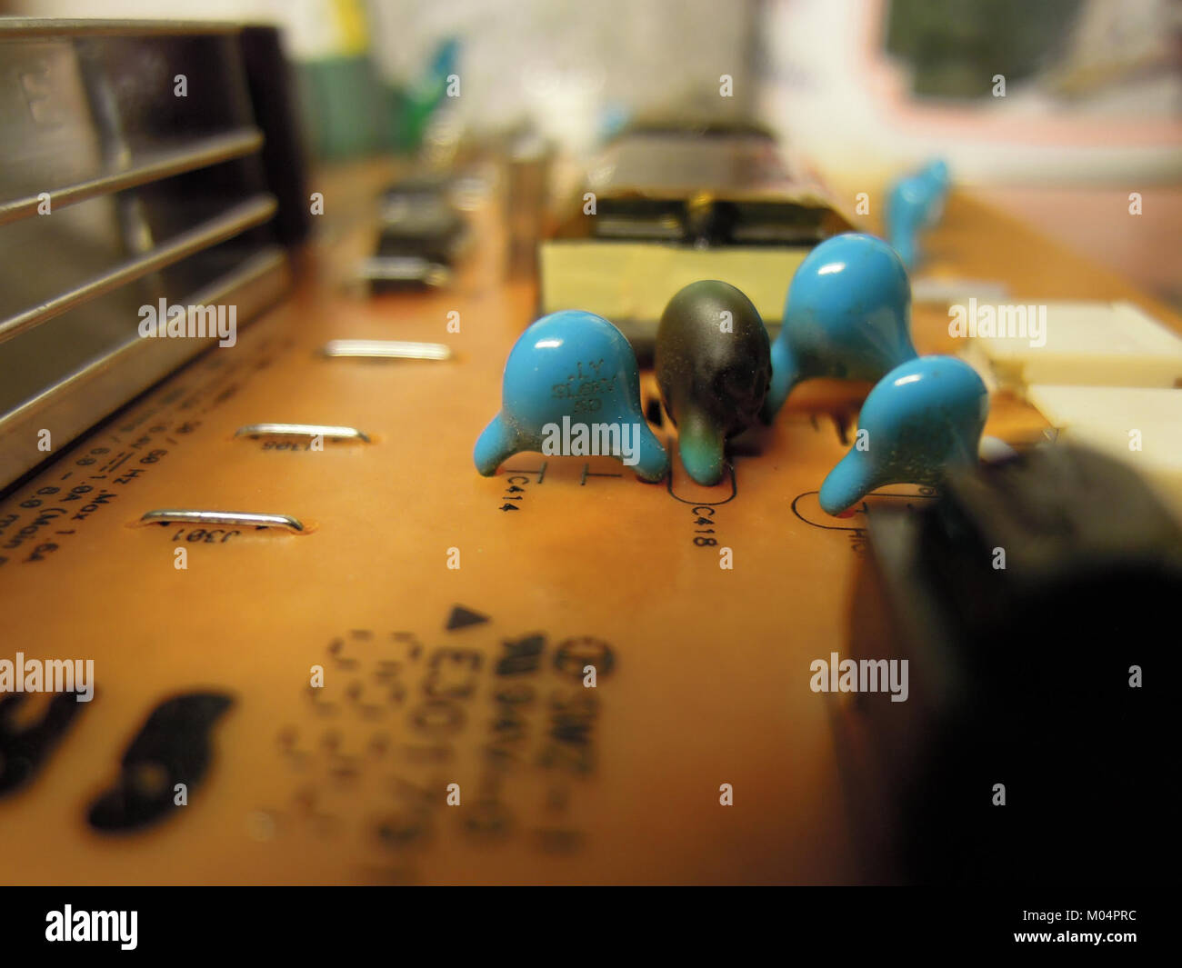 This image depicts a burnt high-voltage capacitor (LYSL6KV5D) on an ...
