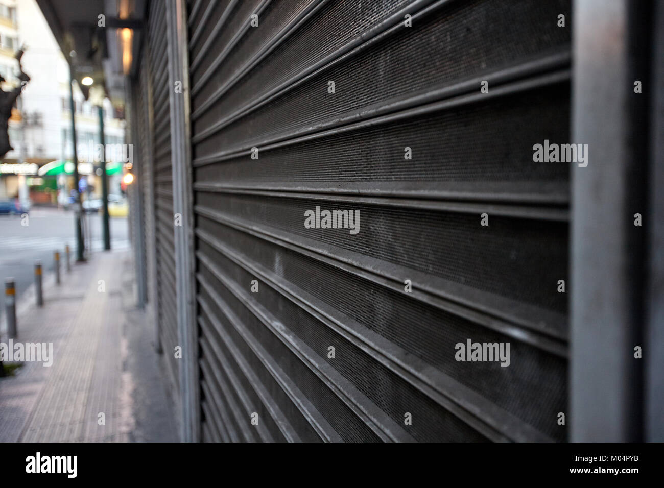 Metal gate protecting a store. Close shop Stock Photo - Alamy