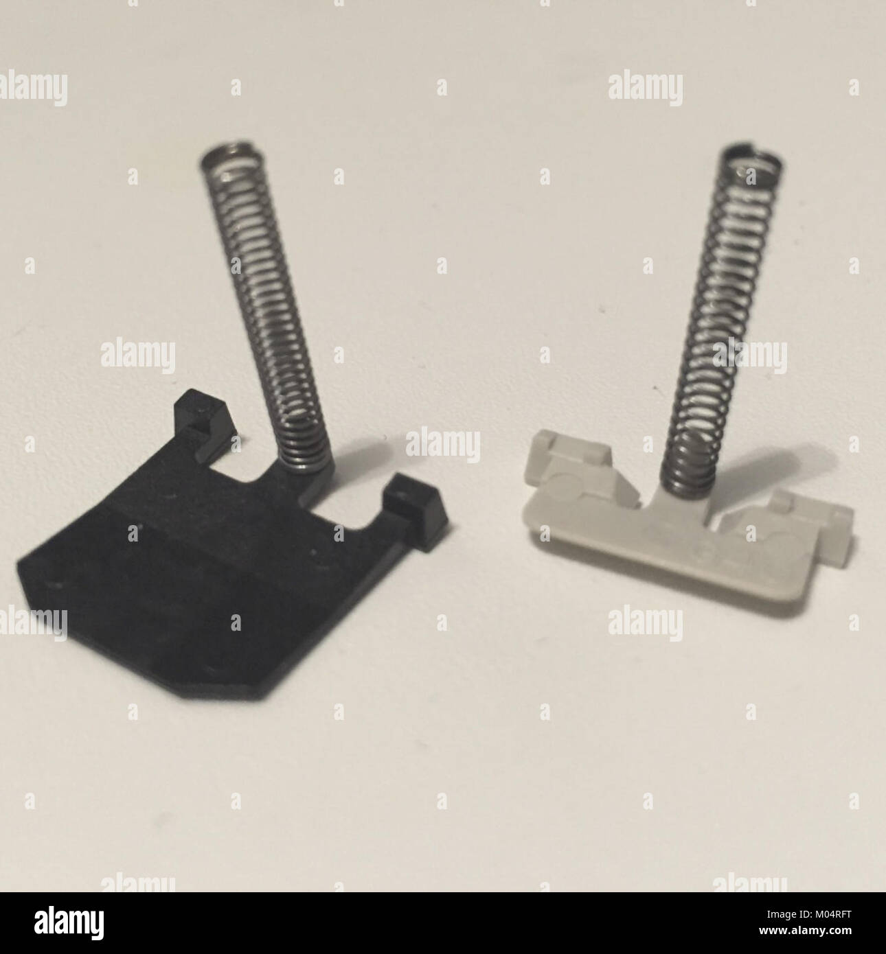 This image compares different types of buckling spring mechanisms ...