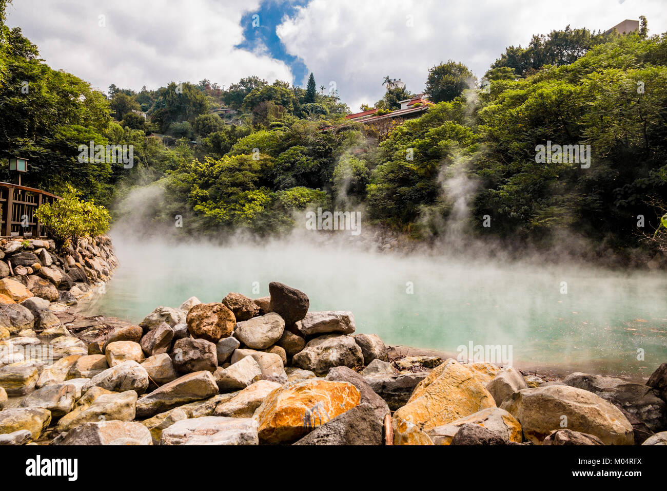 The hot spring at Beitou Thermal Valley, covered with mists, is nearly ...