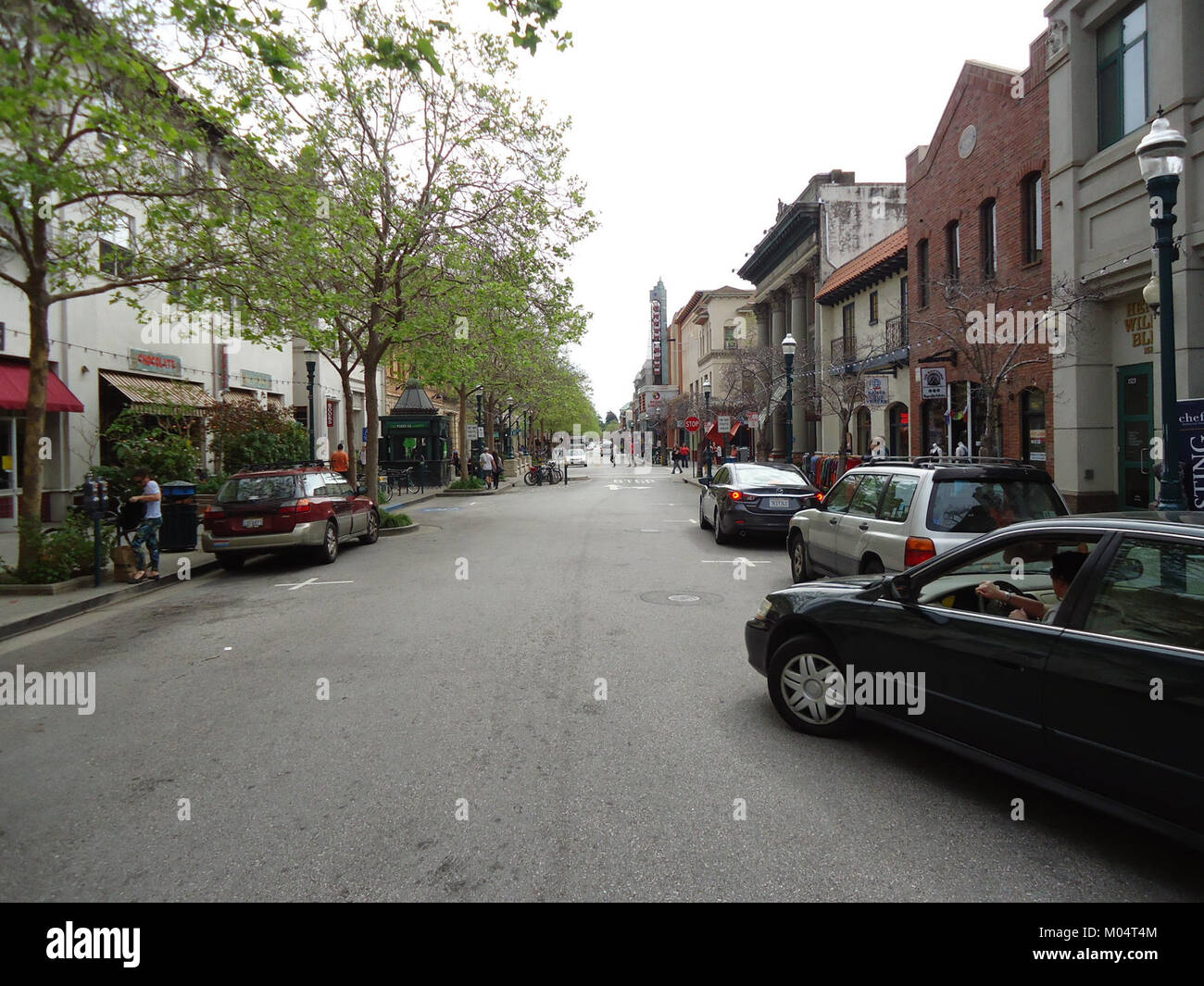 This photograph captures a bustling street scene in Santa Cruz ...