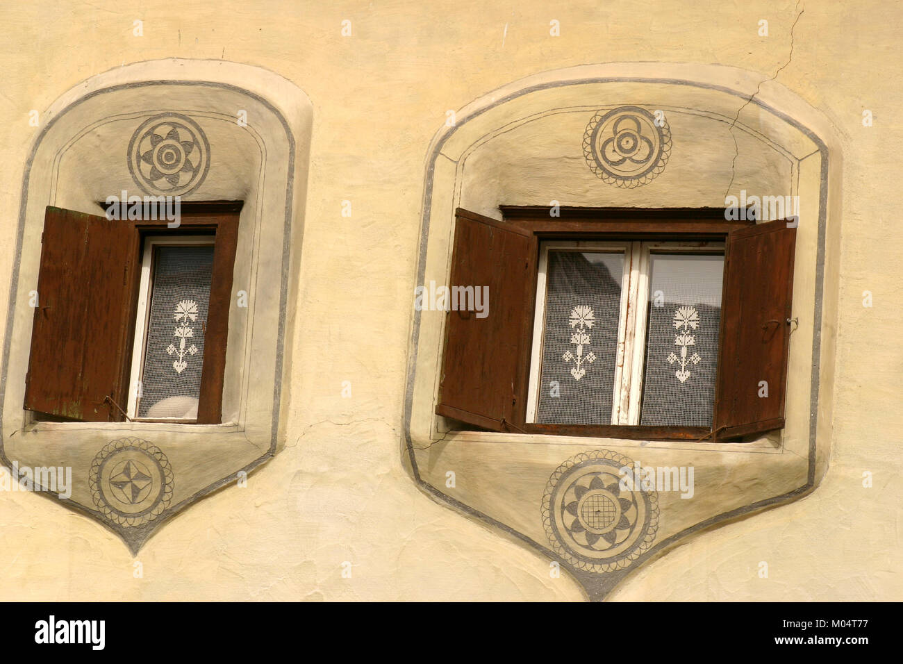 Beautifully ornamented windows in the village of Guarda, Switzerland ...
